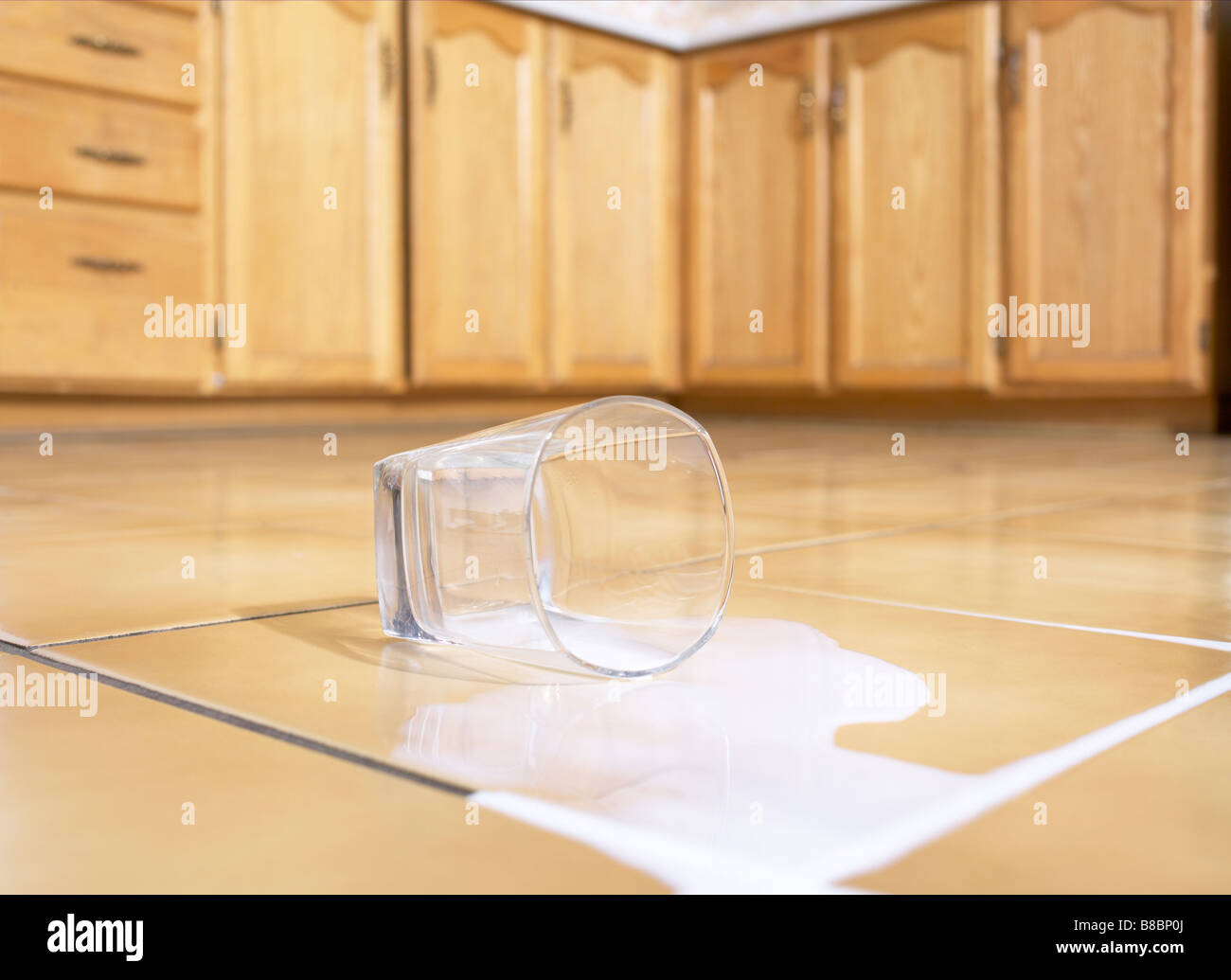 Spilled Glass Milk Tile Floor Stock Photo - Alamy