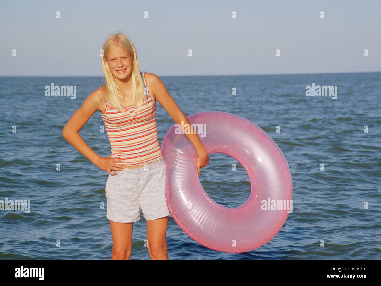 Girl Lake Pink Inner Tube Stock Photo - Alamy