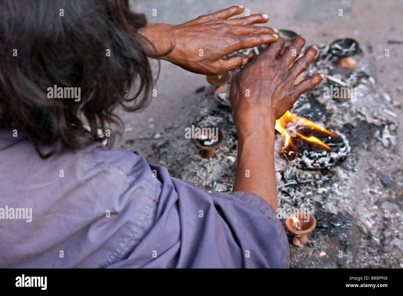 Homeless in Kathmandu keeping warm on the streets with the help of the ...