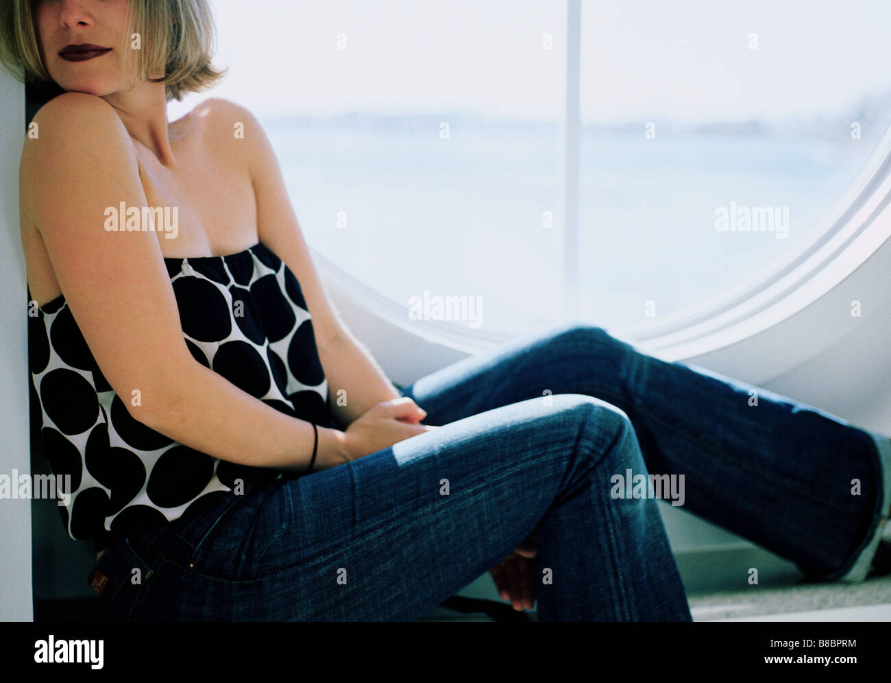 Young Women sitting Window Sill Stock Photo - Alamy