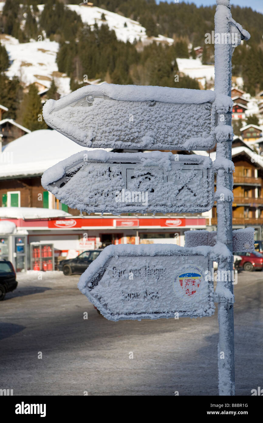 Snow covered road signs Stock Photo - Alamy