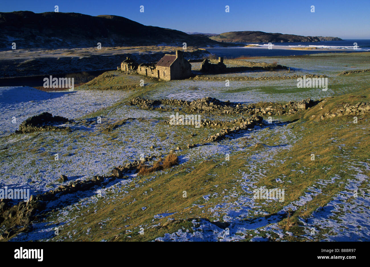DERELICT CROFT WALLS AND FIELDS DUSTED WITH SNOW TORRISDALE BAY ...
