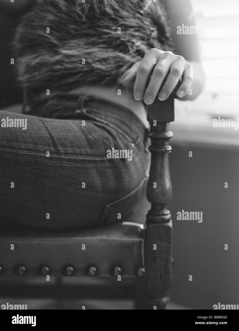Womans legs sitting chair hi-res stock photography and images - Alamy