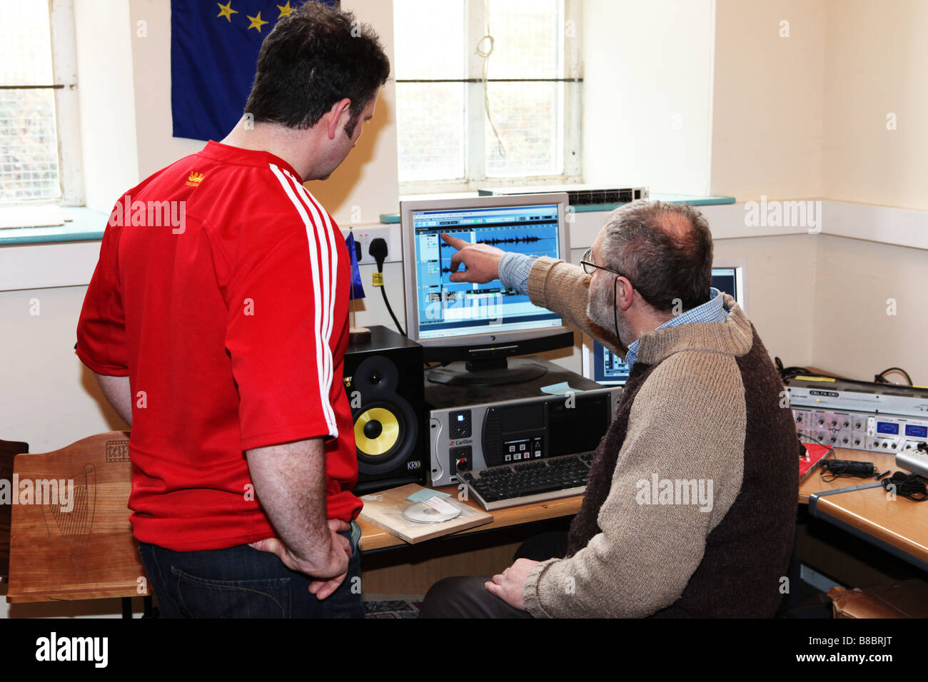 Teacher provides instruction on how to use a complicated audio ...