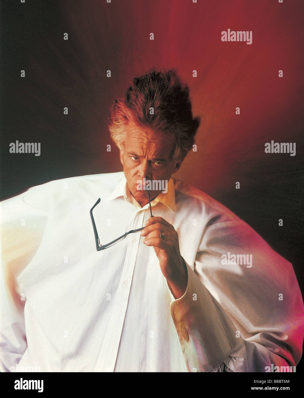 FL4597, Jim Tinios; Distorted Devilish Businessman holding Eyeglasses ...