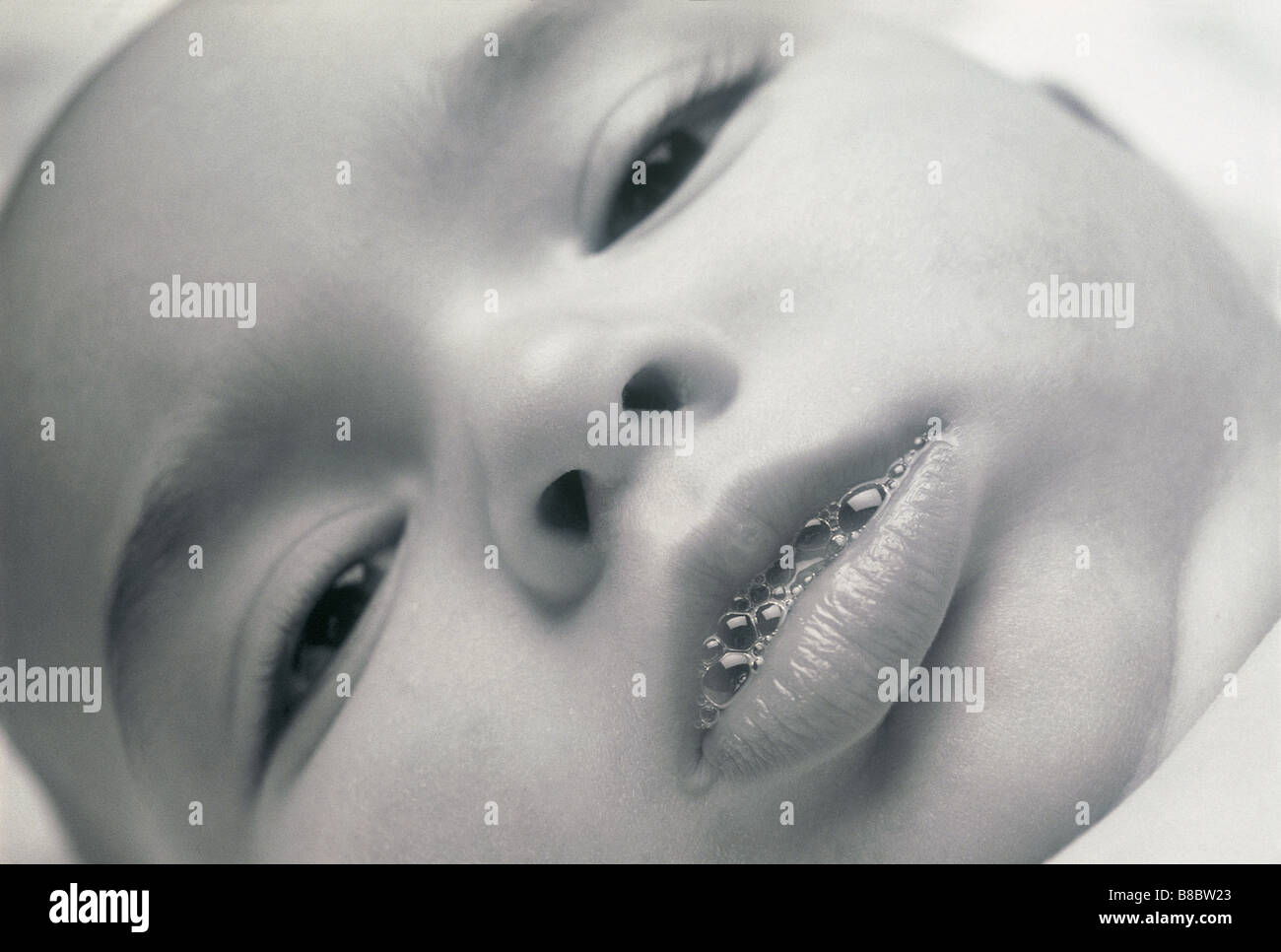 FL4812, Matthew Plexman; Close-up, Babys Face Bubbling Mouth, BW Stock ...