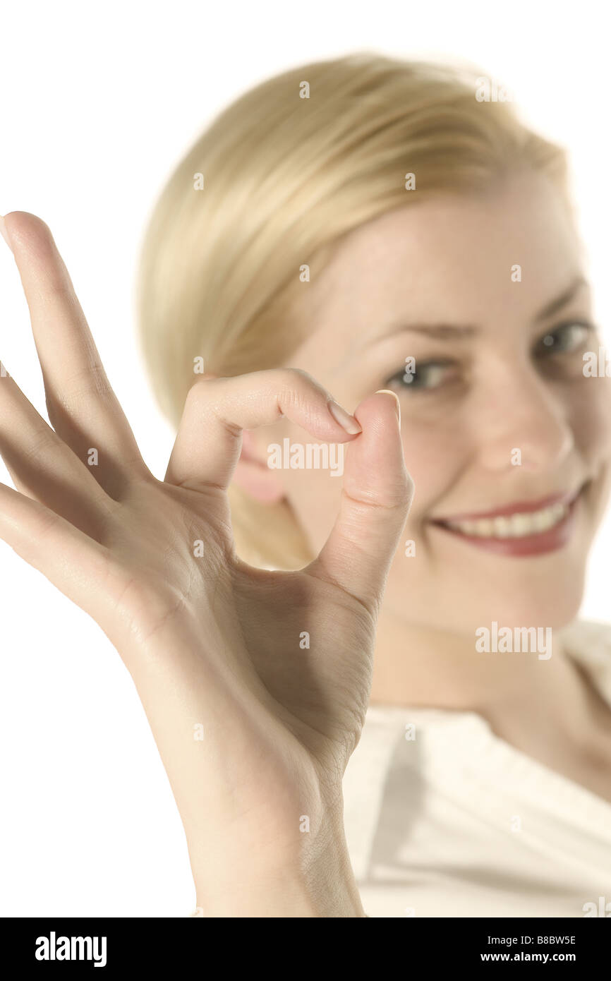 Girl Making OK Hand Gesture Stock Photo - Alamy