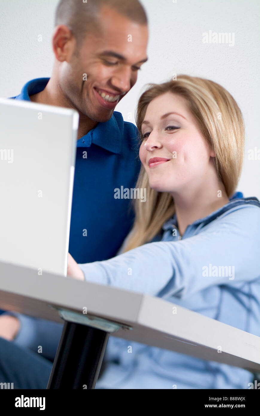Young Couple Looking Computer Stock Photo - Alamy