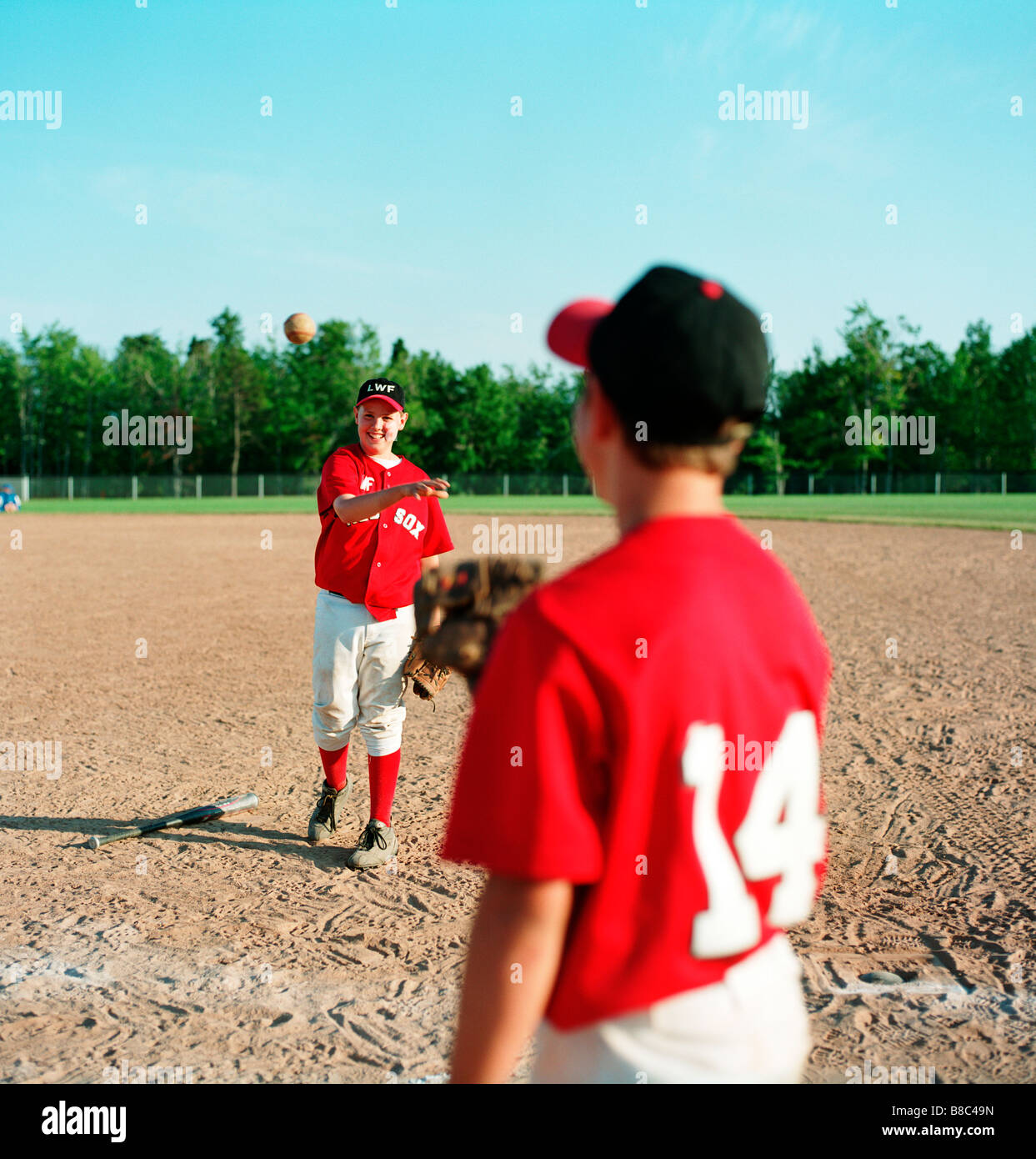 Boys Playing Catch Baseball Diamond Stock Photo - Alamy