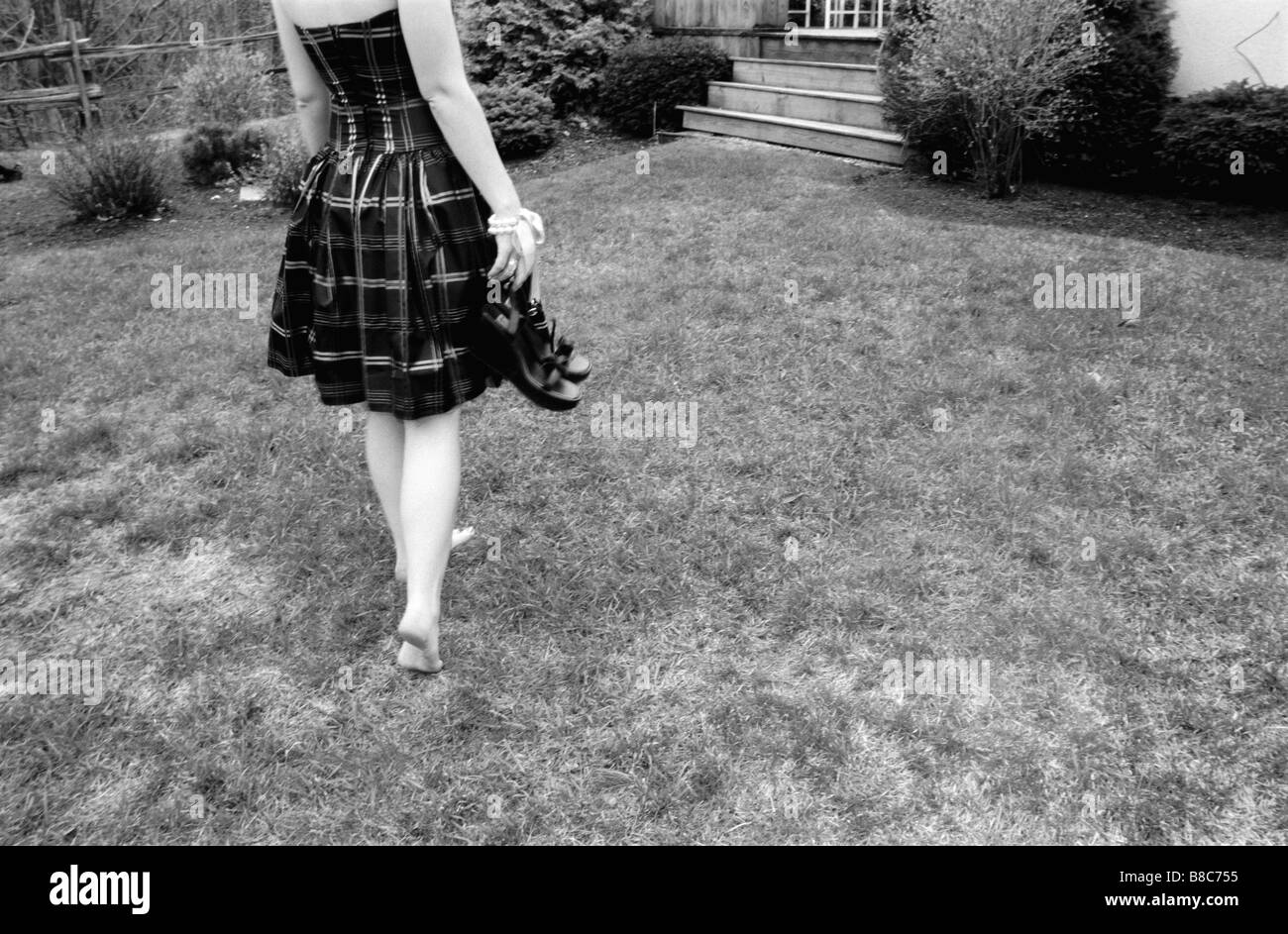 Girl Walking Grass carrying Shoes, Montreal, Quebec B/W Stock Photo - Alamy