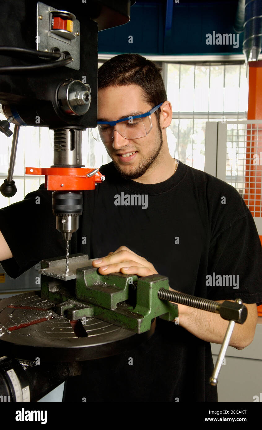 High school Student using Drill Press Stock Photo - Alamy