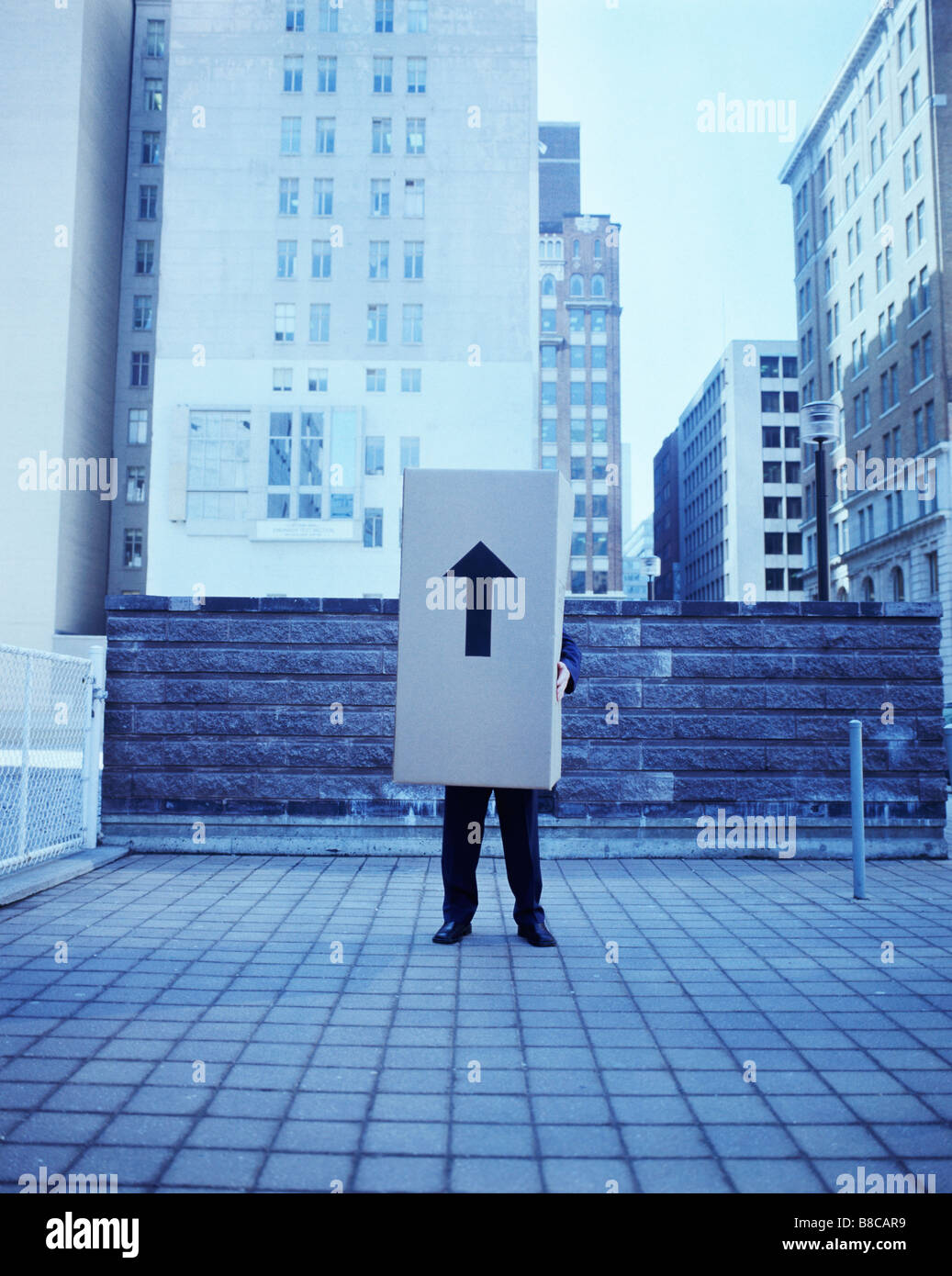 FL6154, Hiep Vu ; Man Carrying Large Box Arrow Pointing Up, Amidst fice ...