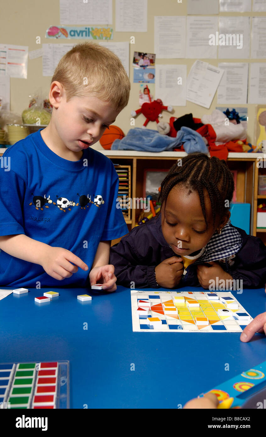 Four Year Old Boy Girl Playing Puzzles Classroom Stock Photo Alamy four-year-old-boy-girl-playing-puzzles-classroom-stock-photo-alamy