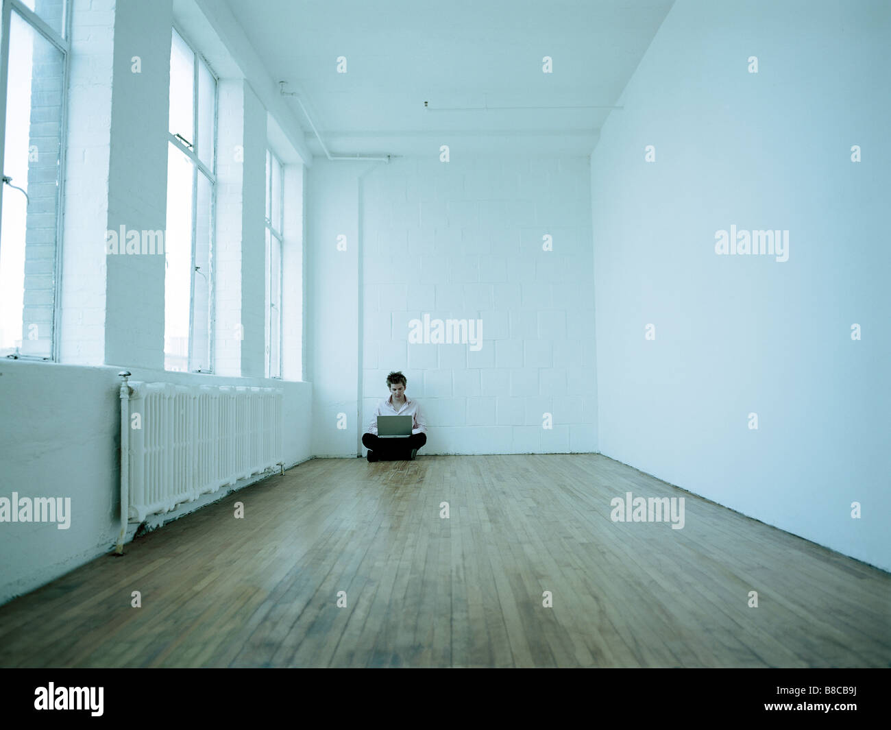 FL6164, Huy Lam; Businessman sitting Cross-legged Floor Against Far ...