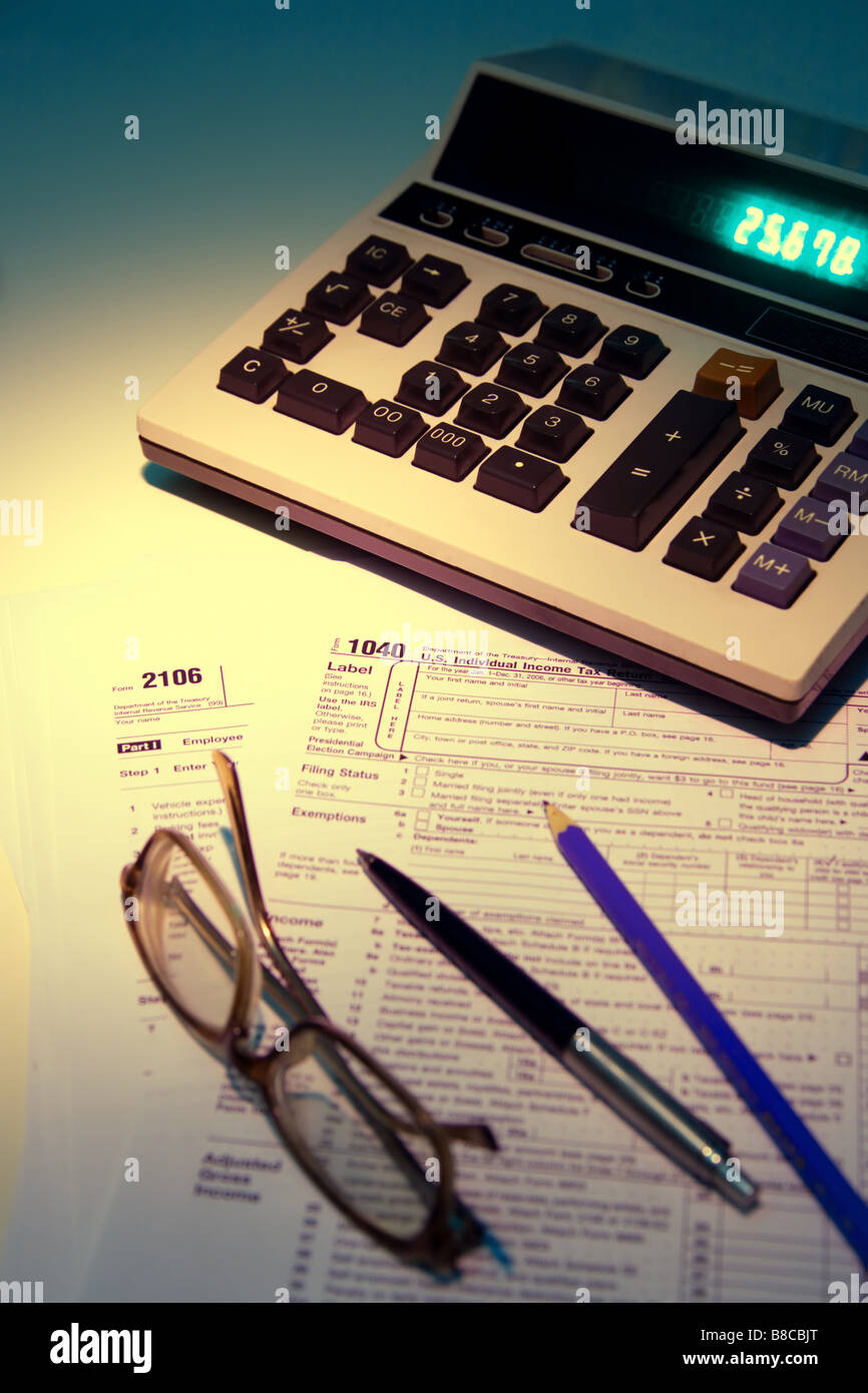 Tax forms and calculator used color filters Stock Photo - Alamy