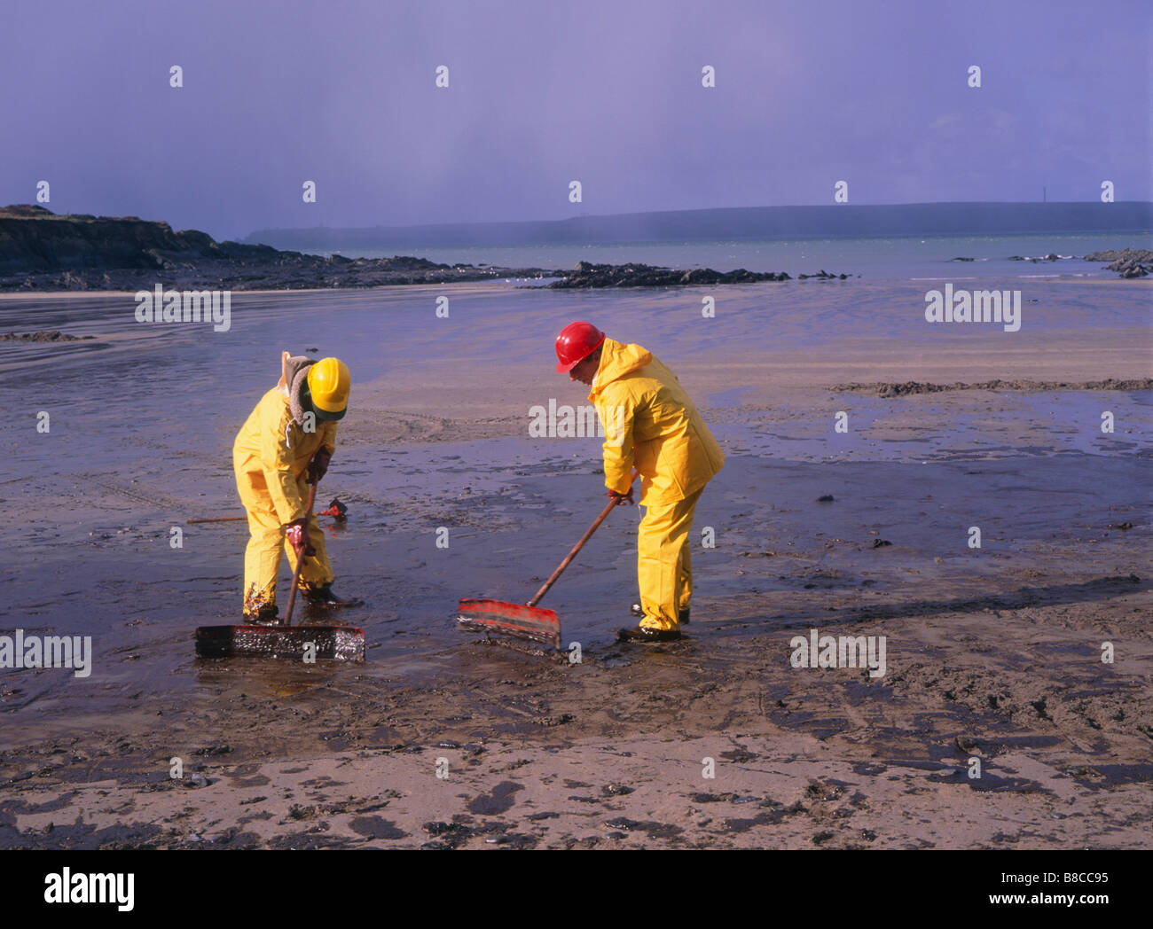 Council workers cleaning beach Stock Photo - Alamy