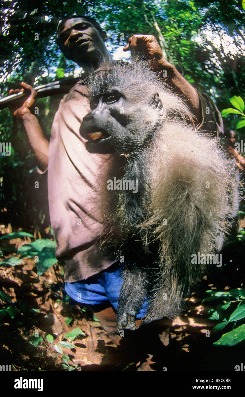 Bush meat hunter returning to camp Stock Photo - Alamy
