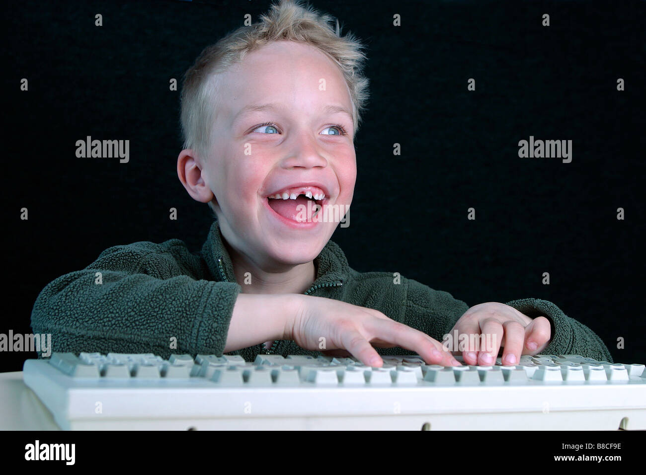 Boy Using Computer Stock Photo - Alamy