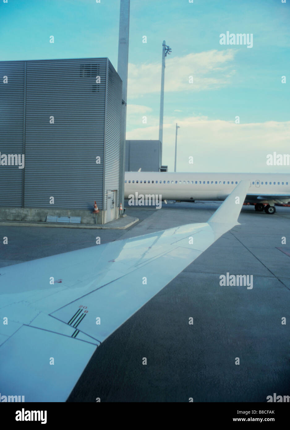 Detail of airplane wing in airport Stock Photo - Alamy