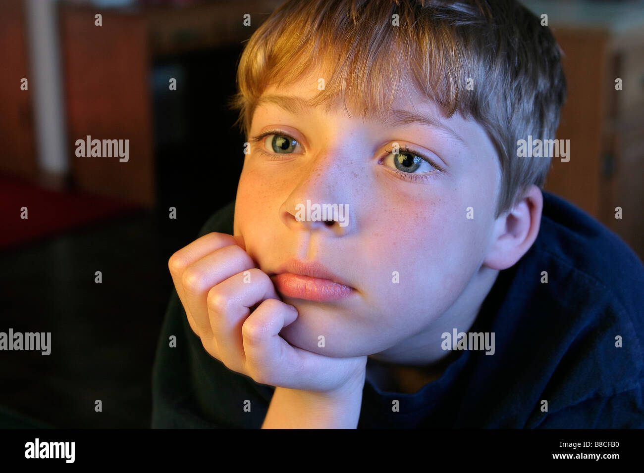 Boy Resting Chin Hand Stock Photo - Alamy