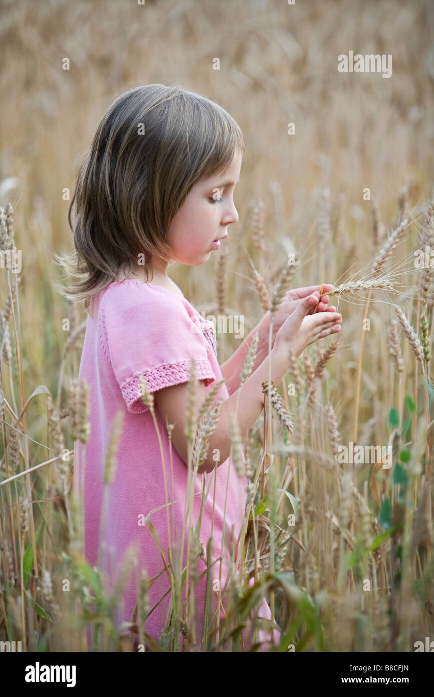 Little Girl in a Field Stock Photo - Alamy