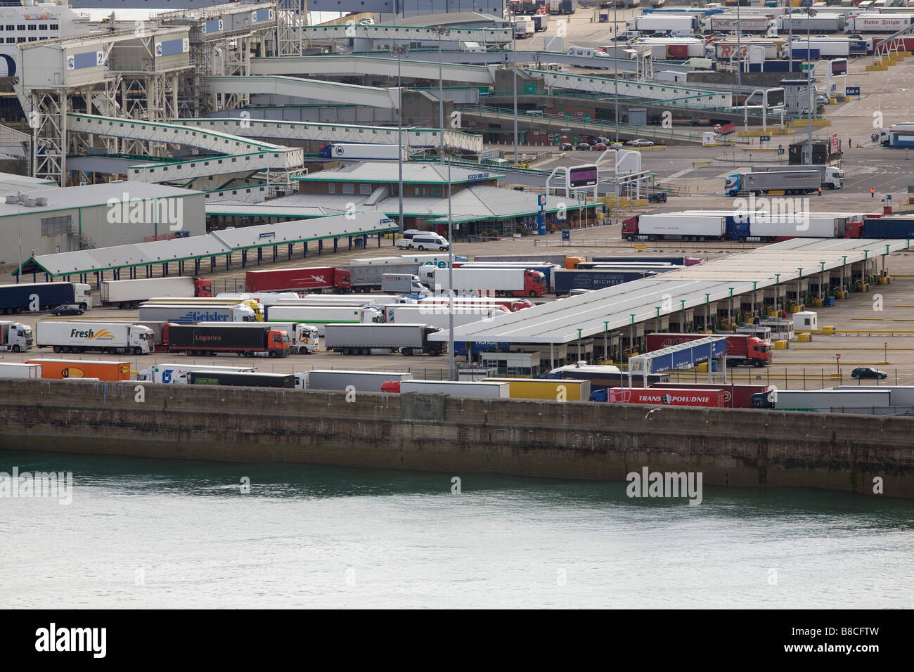Harbor with trucks and ship Stock Photo - Alamy