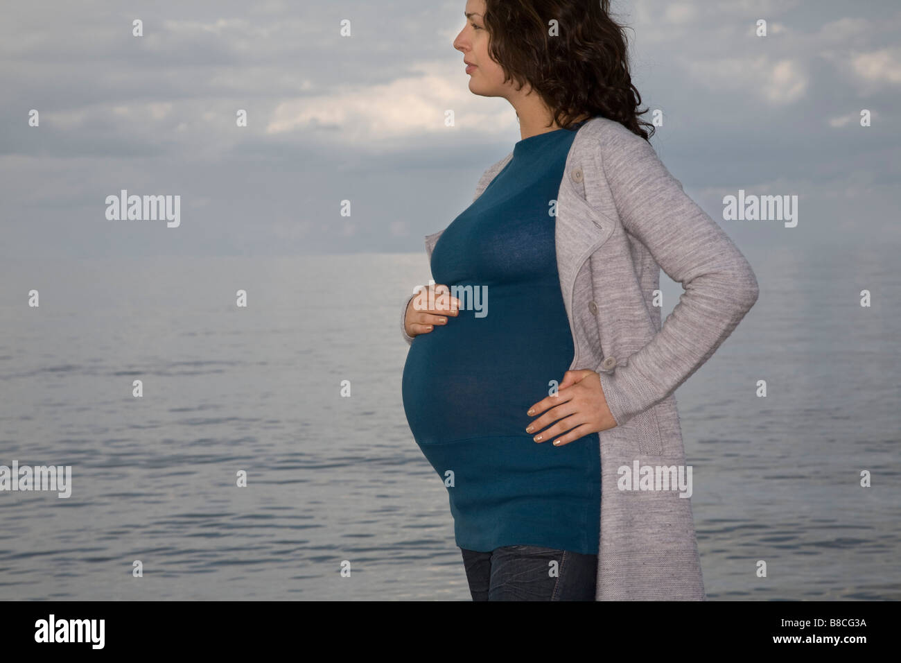 Pregnant woman at ocean Stock Photo - Alamy
