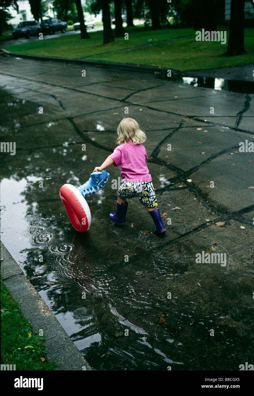 Girl Playing Puddles Inflatable Toy, Winnipeg, Manitoba Stock Photo - Alamy
