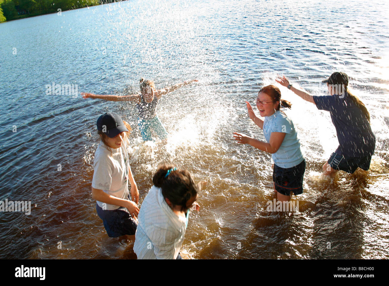 Girls Splashing Lake Stock Photo - Alamy
