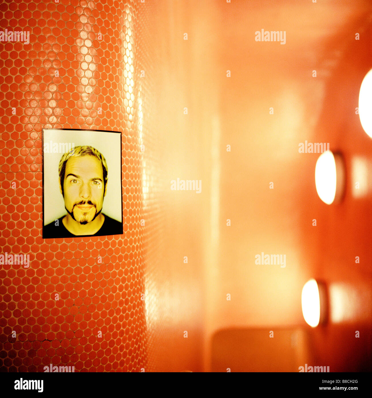 FL6311, Huy Lam; Portrait Man Pinned up Orange Tiled Wall Stock Photo ...