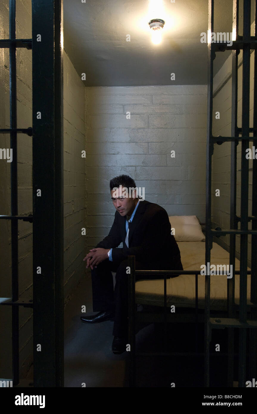 Prisoner Sitting In Prison Cell High Resolution Stock Photography and ...