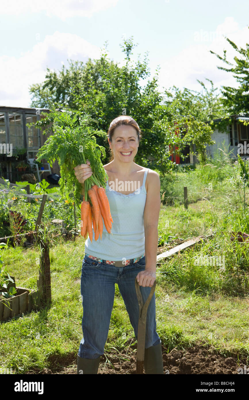 Young woman gardening, portrait Stock Photo - Alamy