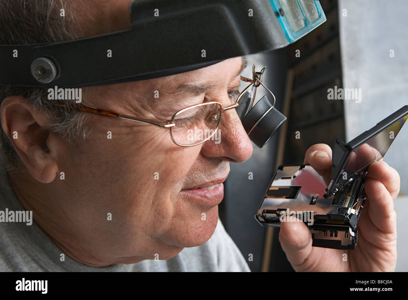 Clock Repairman at Work Stock Photo - Alamy