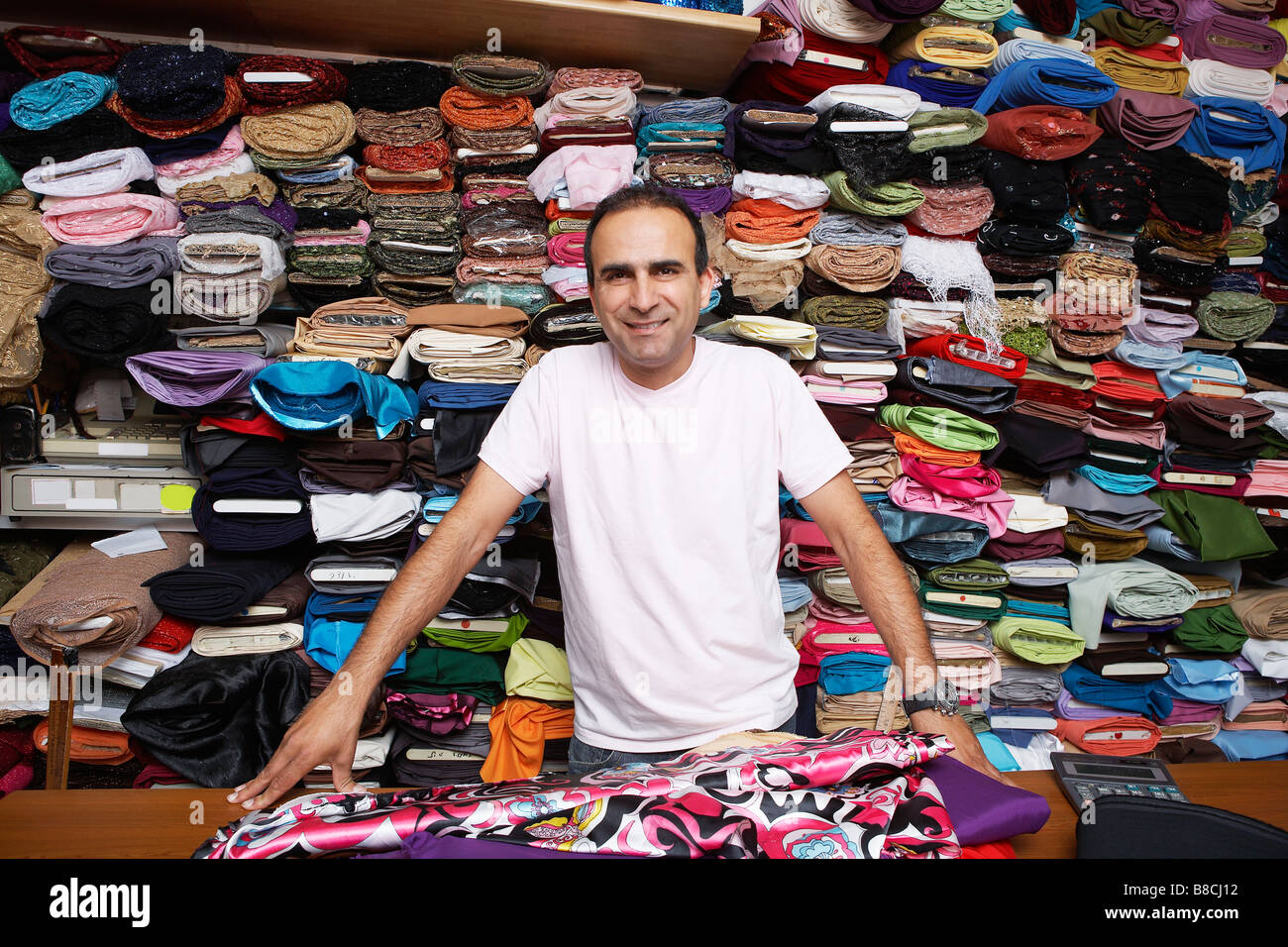 Fabric Store Worker Stock Photo - Alamy