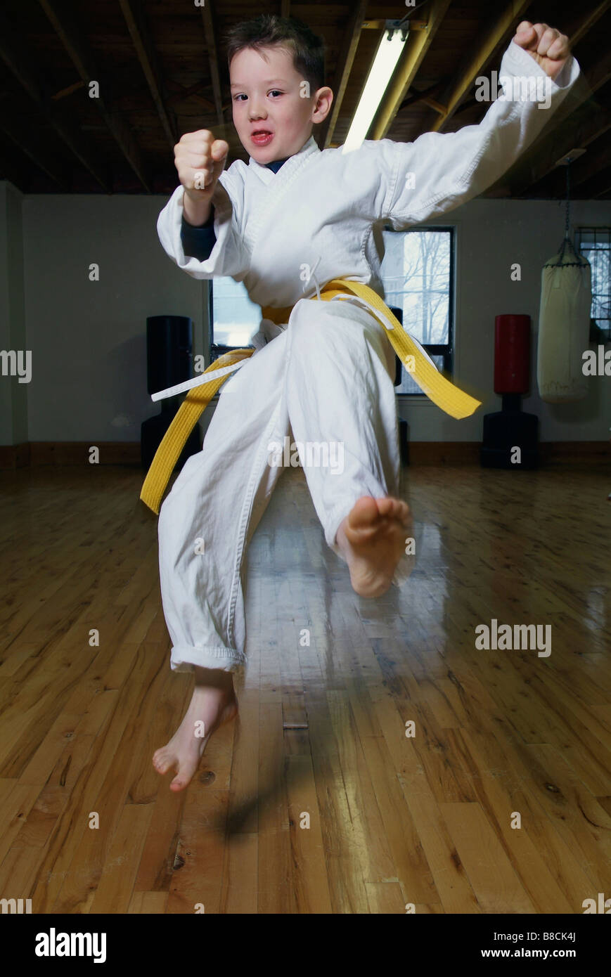 Boy, 7 years old, demonstrating Flying karate Kick Stock Photo - Alamy