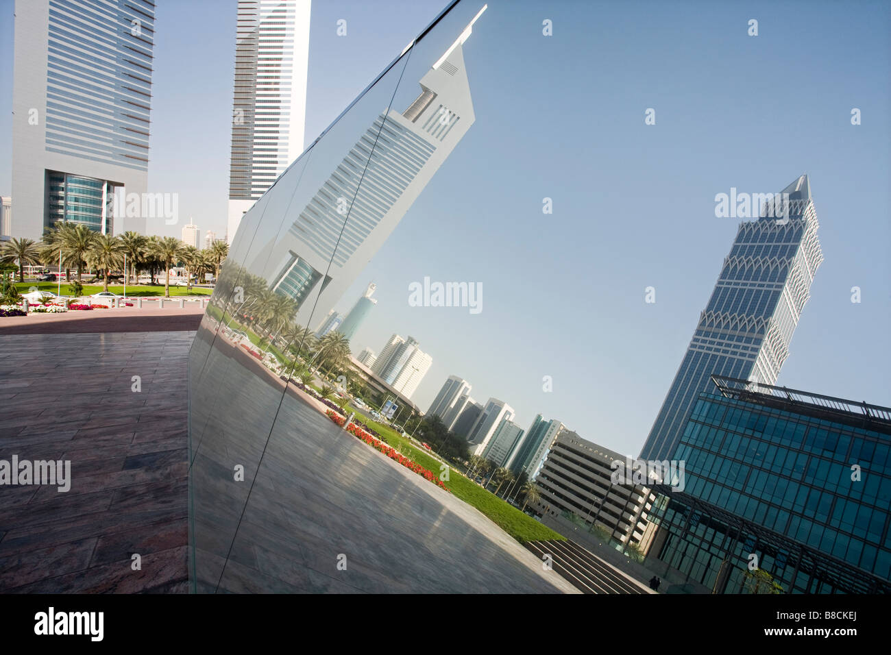 UAE, Dubai, reflection in a mirrored piece of artwork on display at the ...
