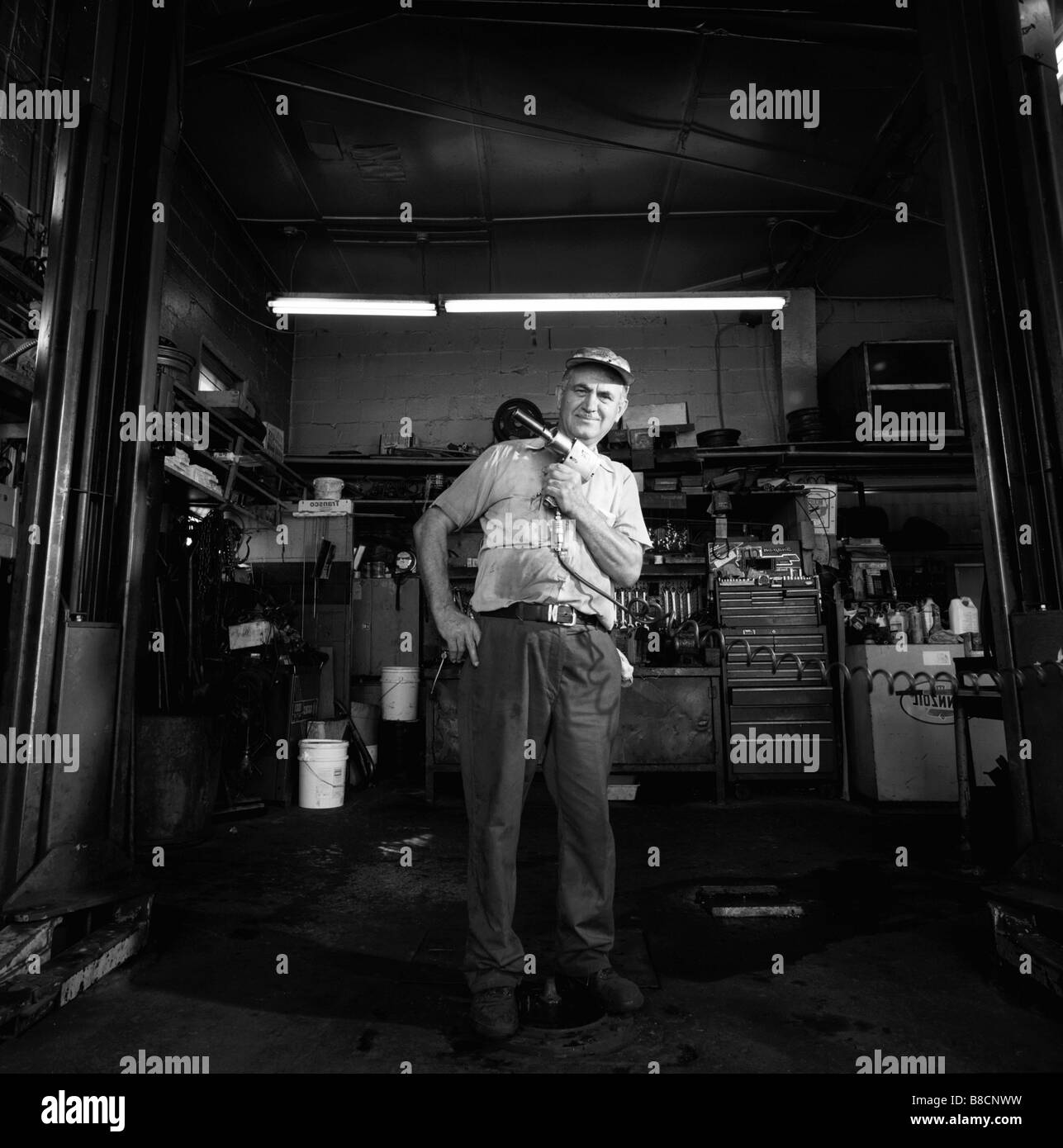 Man Garage, B/W Stock Photo - Alamy