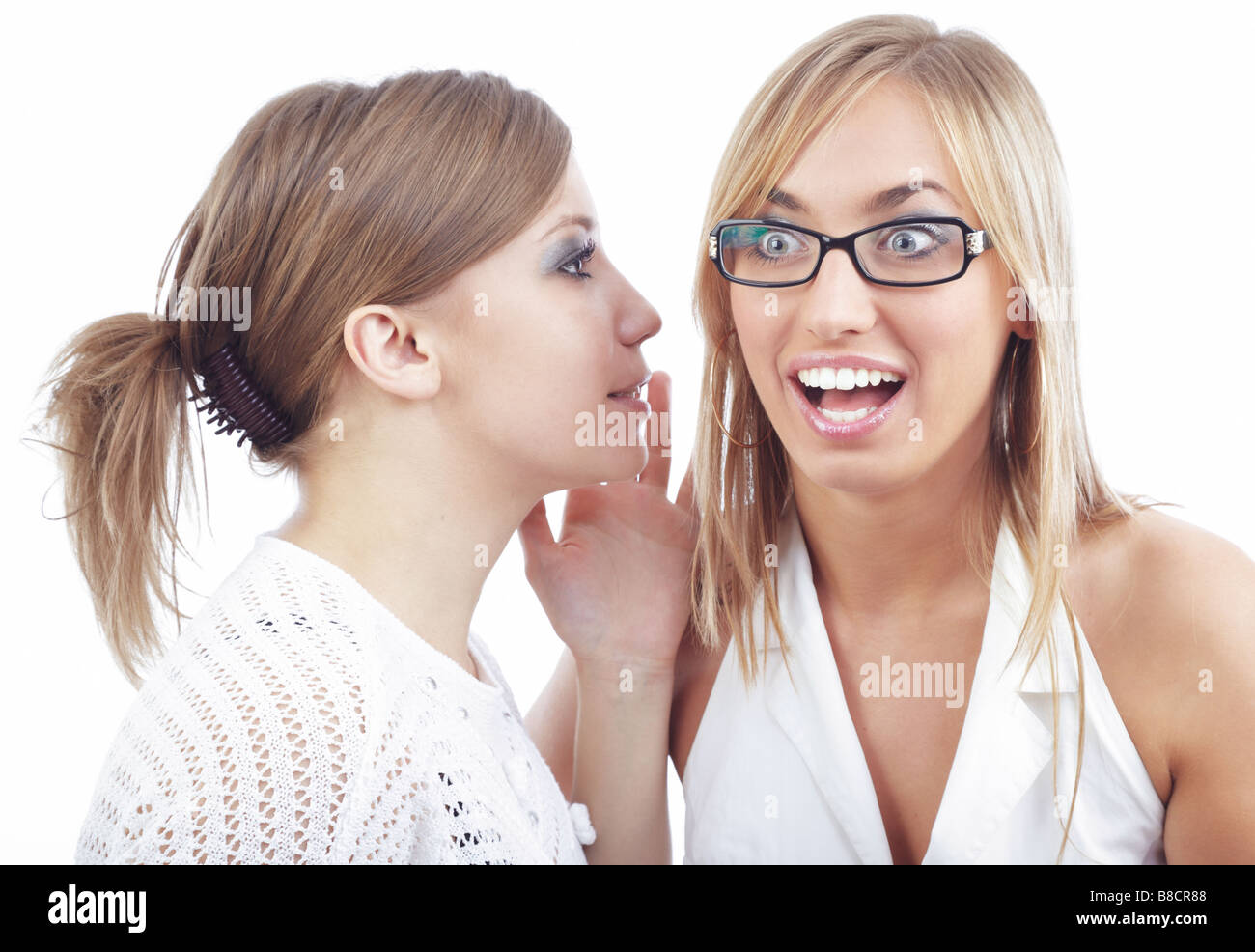 Two friends talking something secret Stock Photo - Alamy