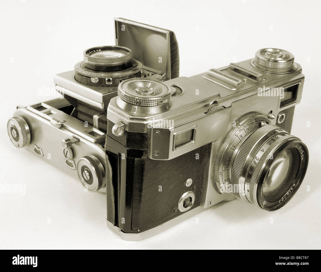 Two antiquarian 35 mm film cameras with put forward lens Stock Photo ...