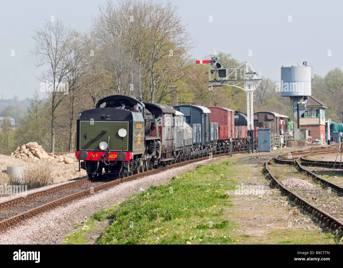 Southern railways livery steam engine pulling freight on the Bluebell ...