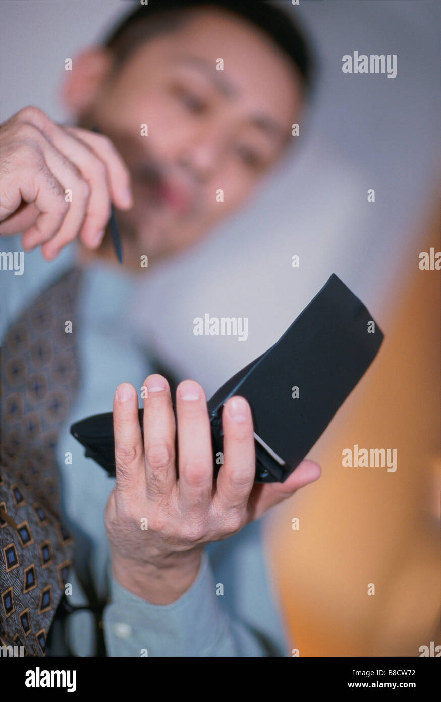 FV0899, Alan Marsh; Man using palm pilot Stock Photo - Alamy