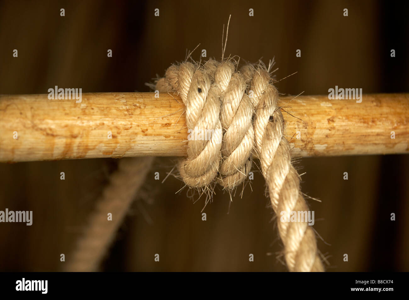 Rope Wrapped around Wood Bar Stock Photo - Alamy