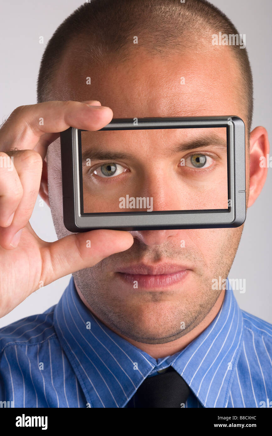 Businessman holding visual screen monitor showing picture of his own ...