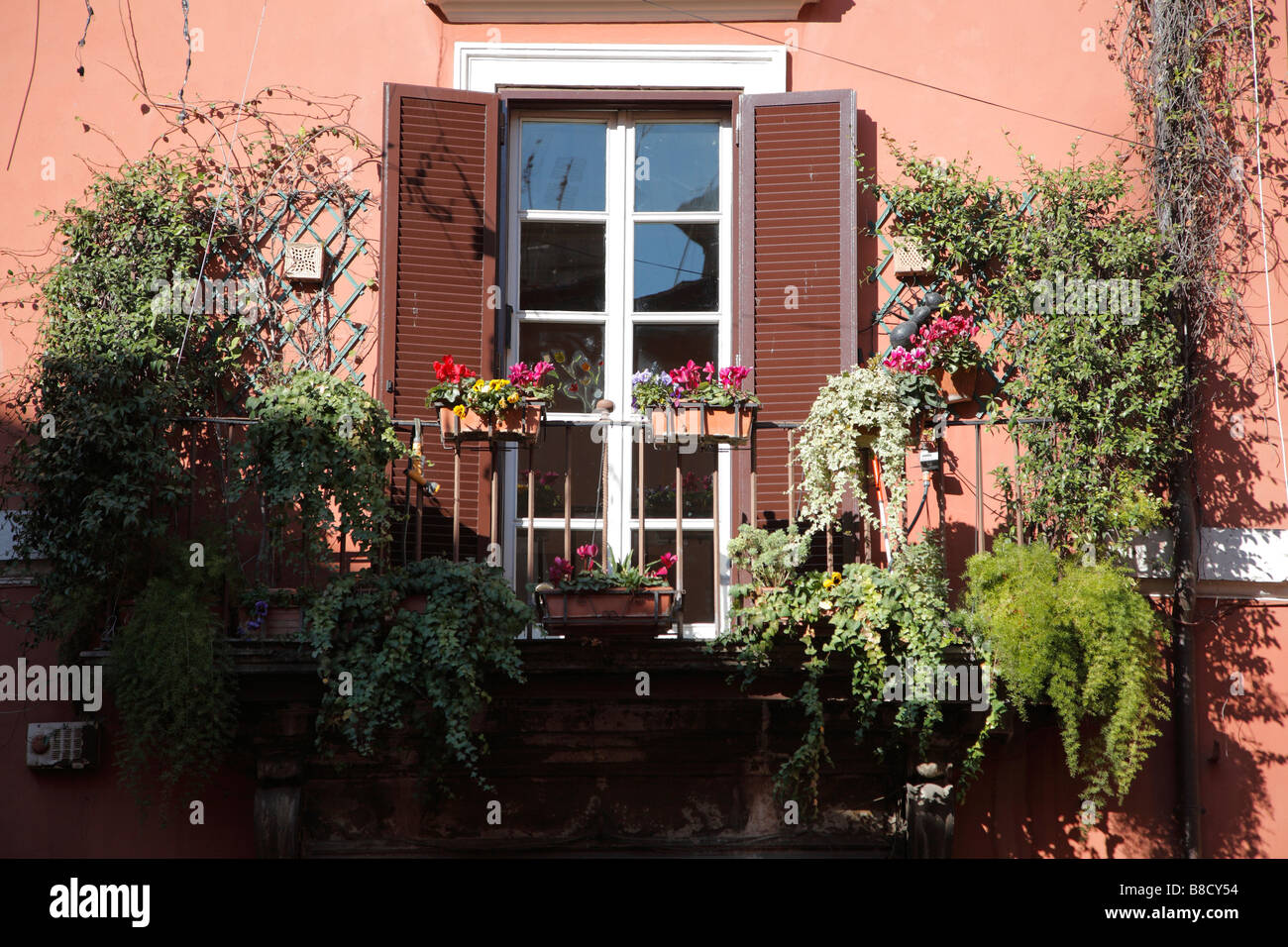 Balcony and window with flowers, Rome, Italy Stock Photo - Alamy
