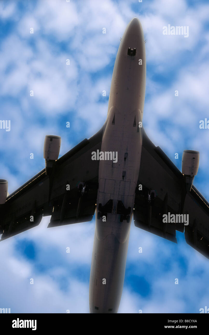 FV2331, Trevor Bonderud; Plane flying against fluffy clouds blue sky ...