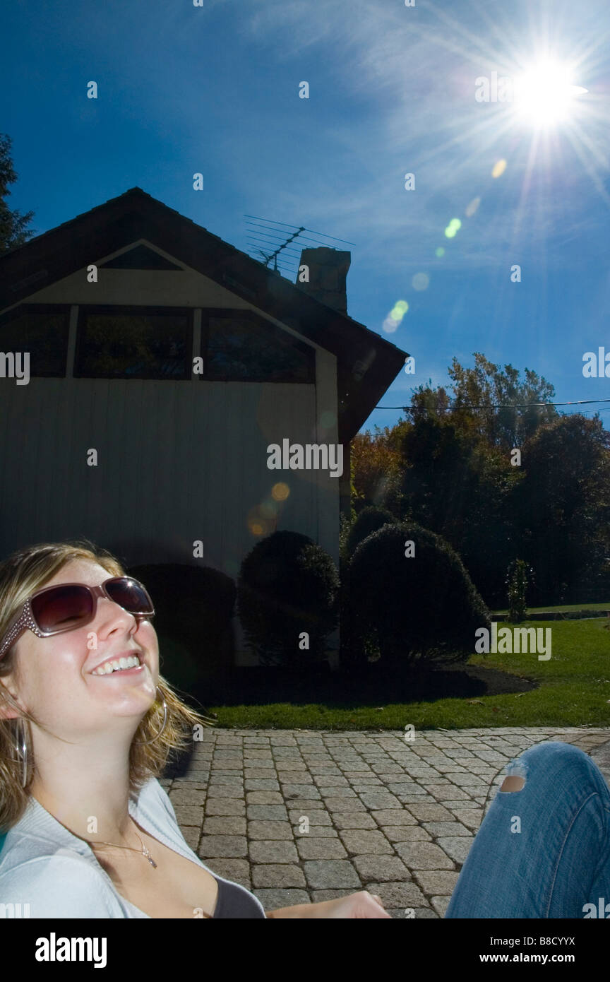 Woman Sitting Outdoors Enjoying Sunshine Stock Photo - Alamy