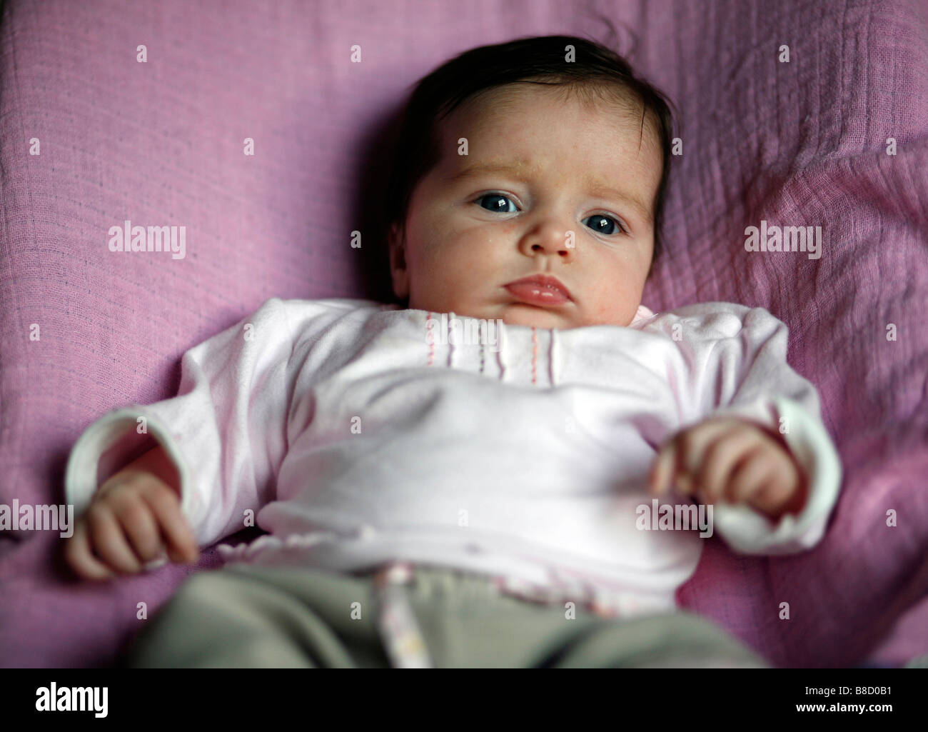 A baby girl lying on its back Stock Photo - Alamy