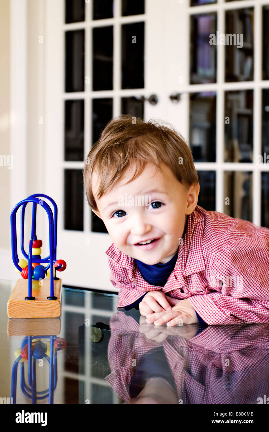Little Boy Leaning Table Stock Photo - Alamy