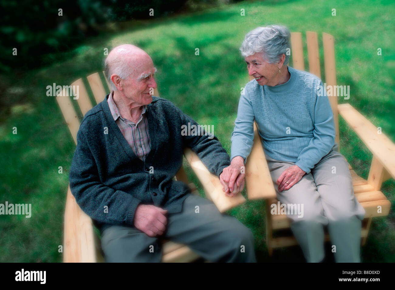 FV2571, Trevor Bonderud; Senior couple sitting, holding hands relaxing ...