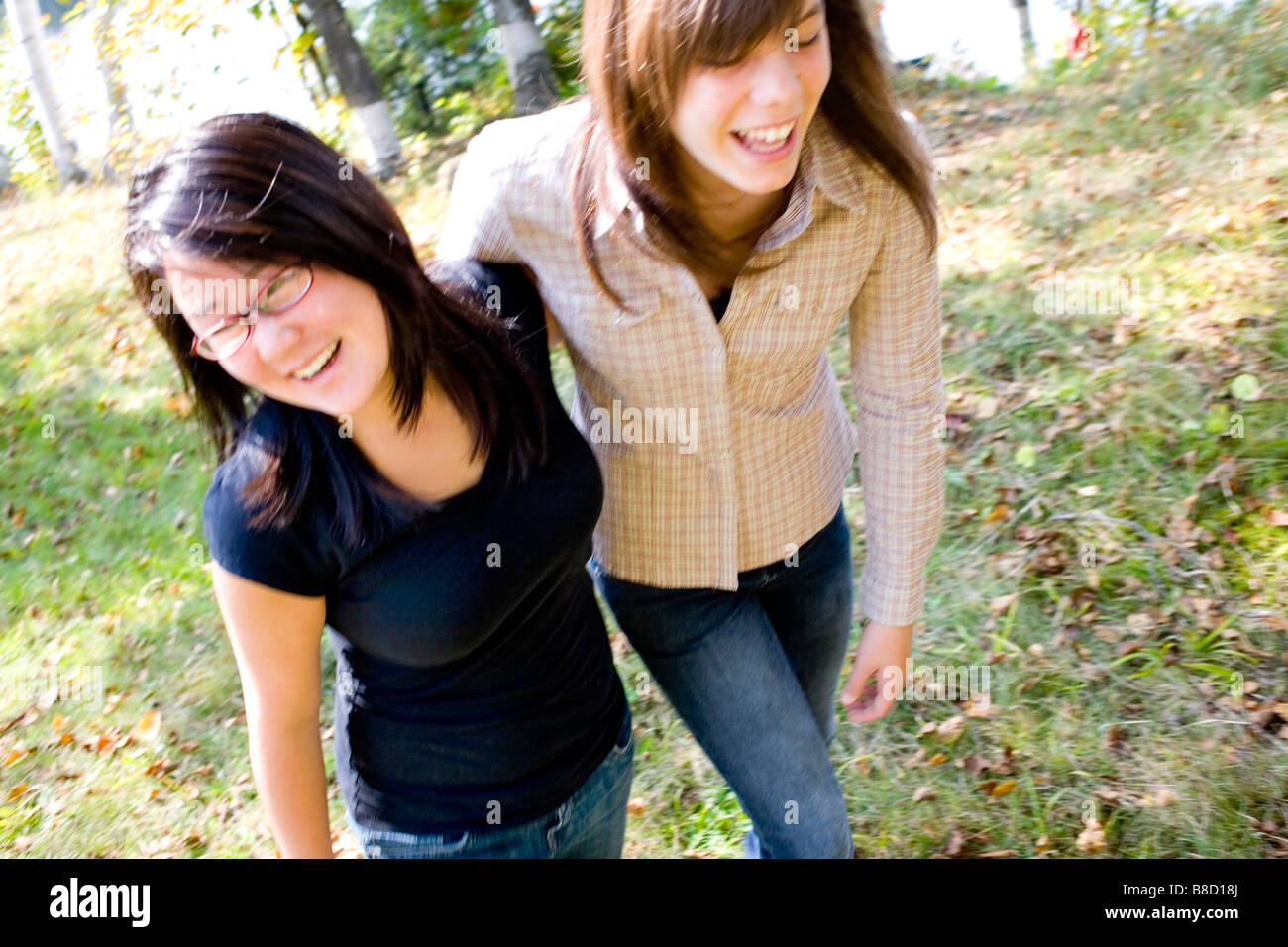 Laughing Young Friends Walking Stock Photo - Alamy